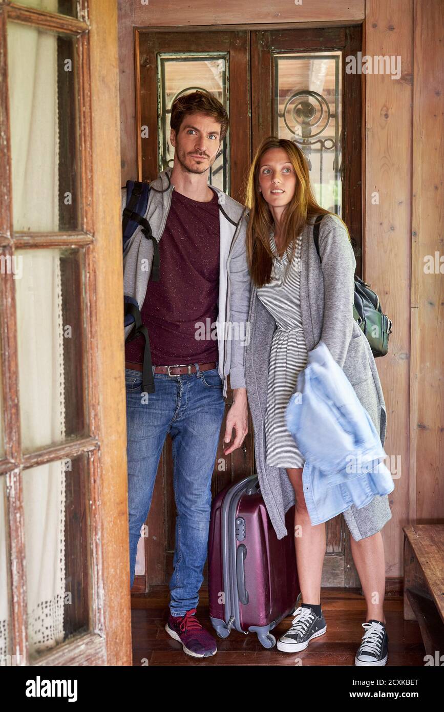 Couple people entering hi-res stock photography and images - Alamy