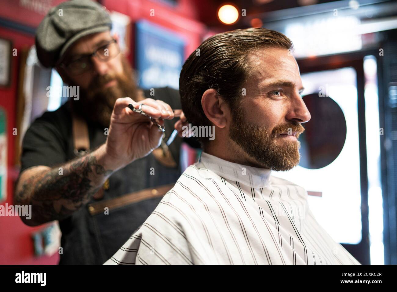 Barber holding scissors in salon hi-res stock photography and images ...