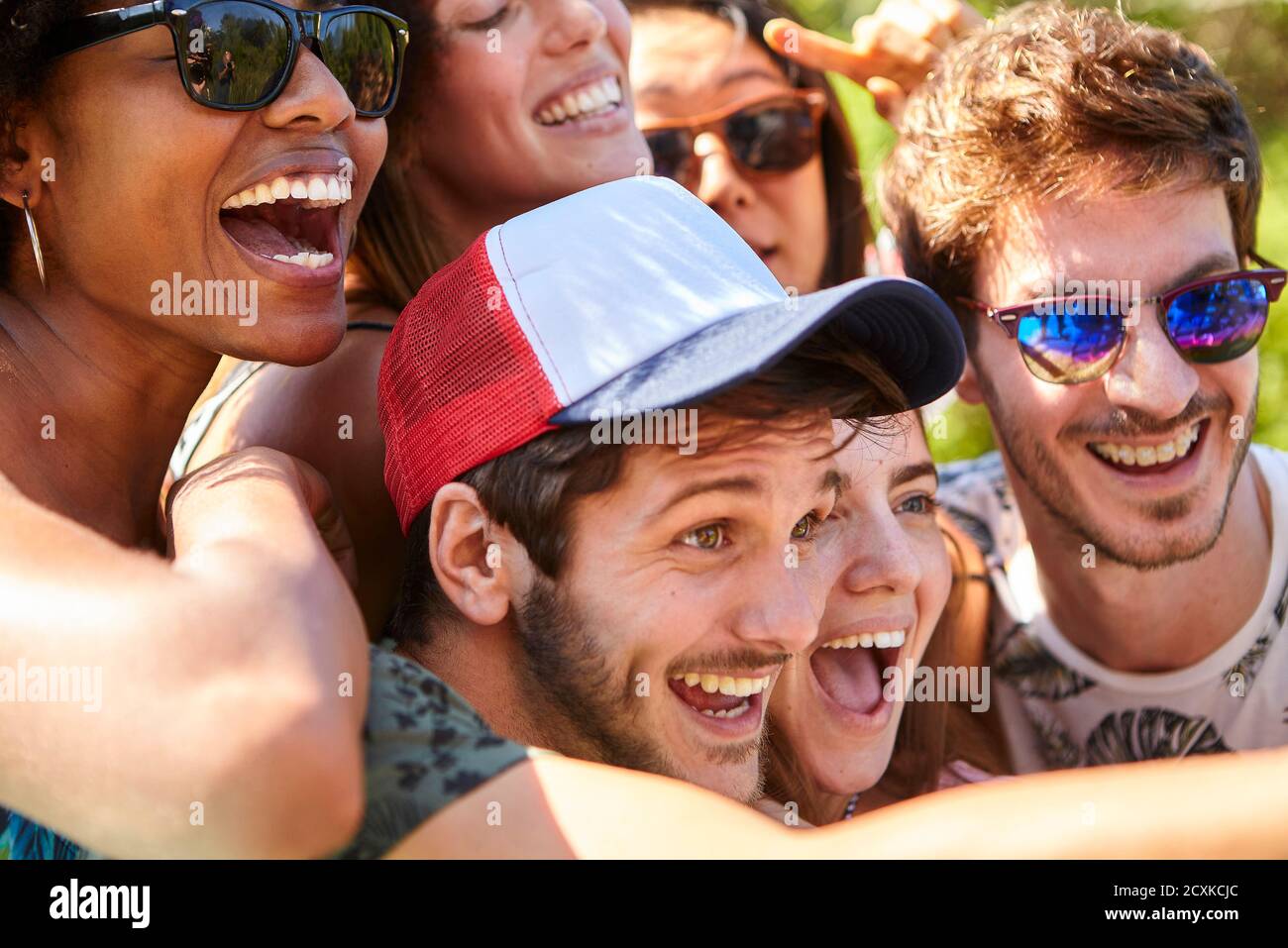 Young friends enjoying pool party Stock Photo - Alamy