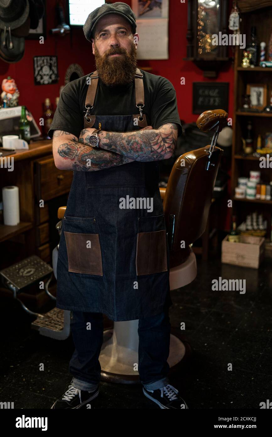 Hairdresser standing in salon Stock Photo - Alamy