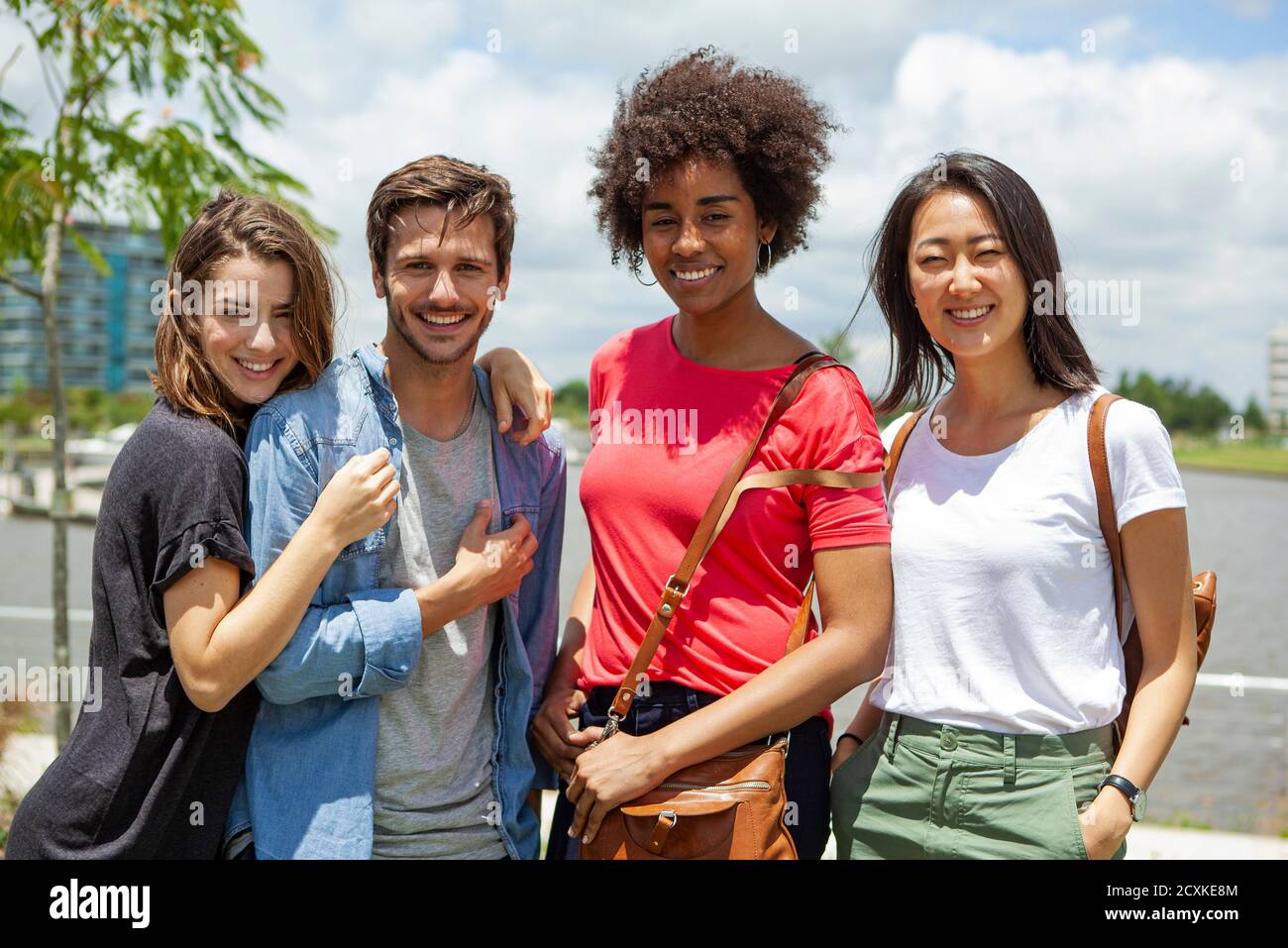 Four friends holding hands arms hi-res stock photography and images - Alamy