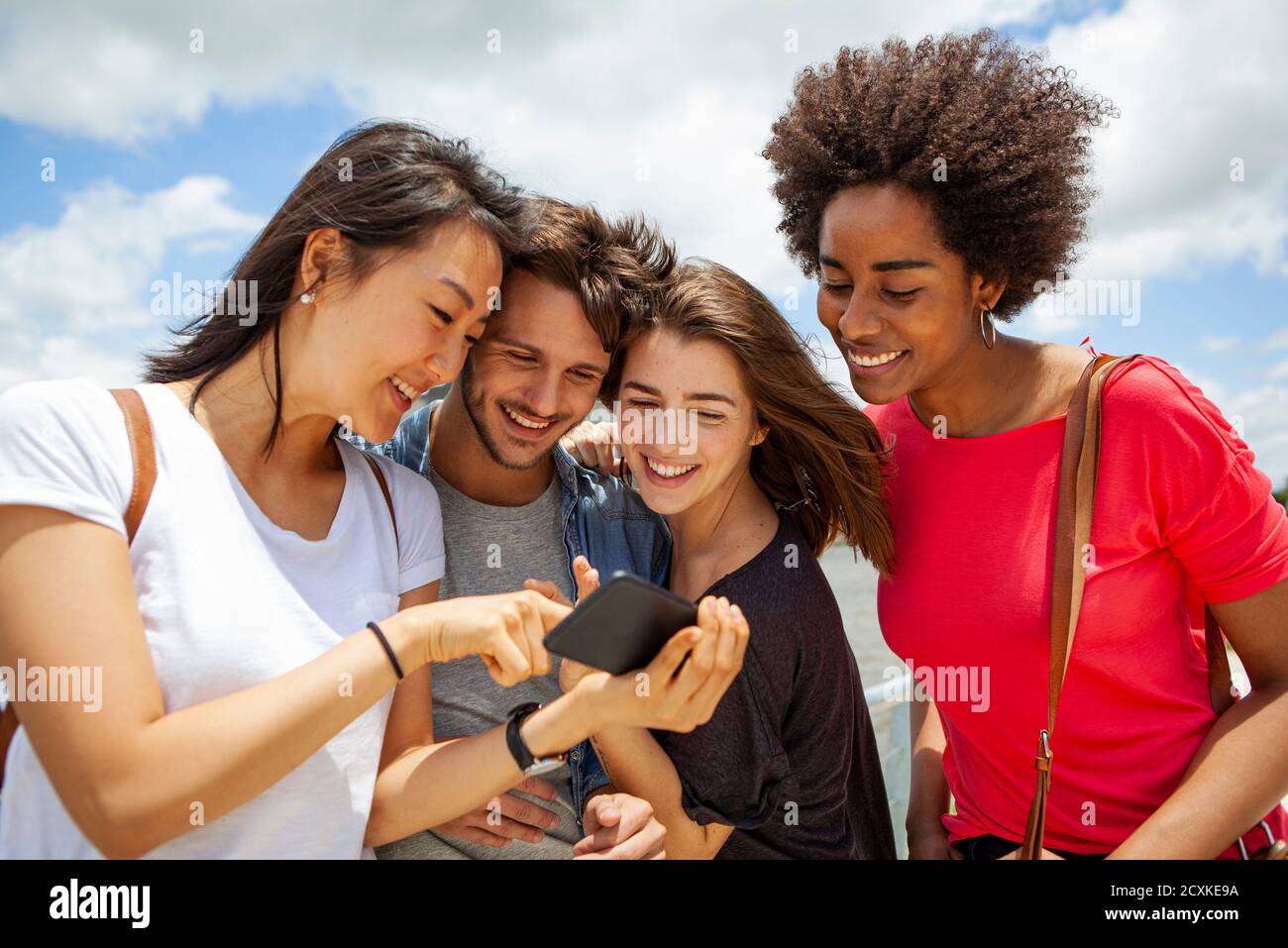 Watching phone laughing hi-res stock photography and images - Alamy
