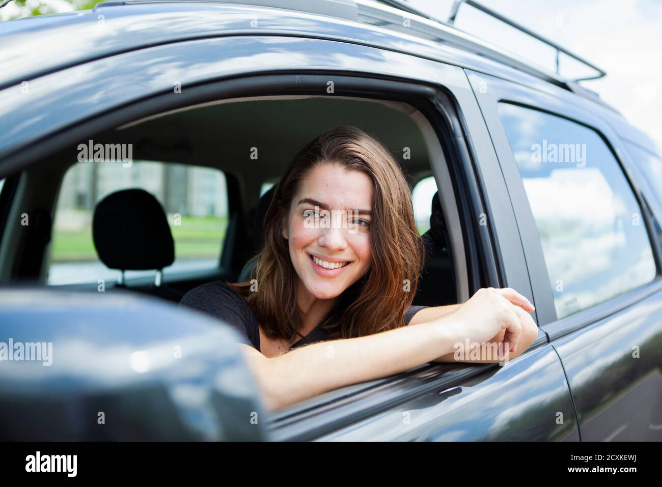 Car front view woman sitting hi-res stock photography and images - Alamy