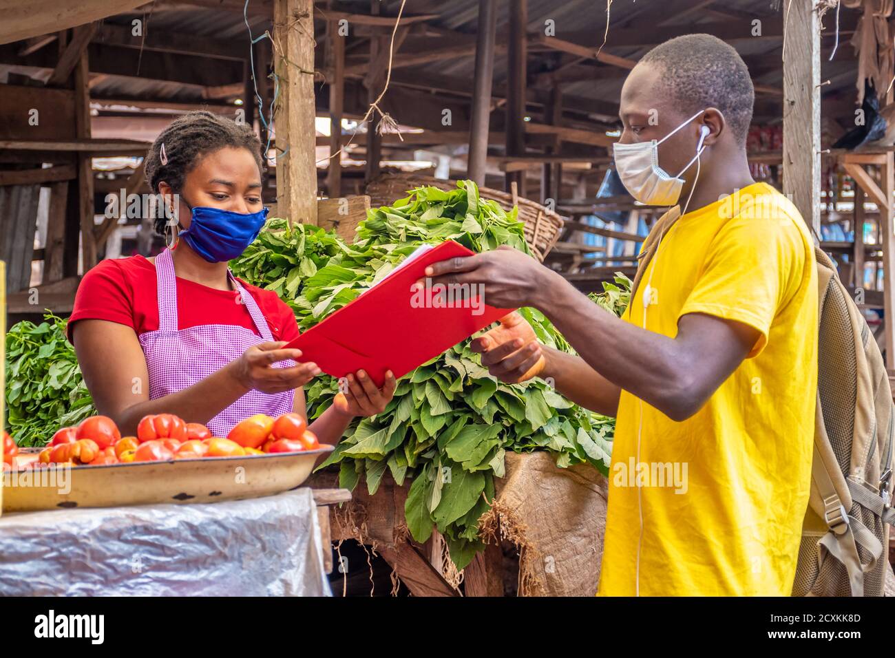 Female client picking up parcel hi-res stock photography and images - Alamy