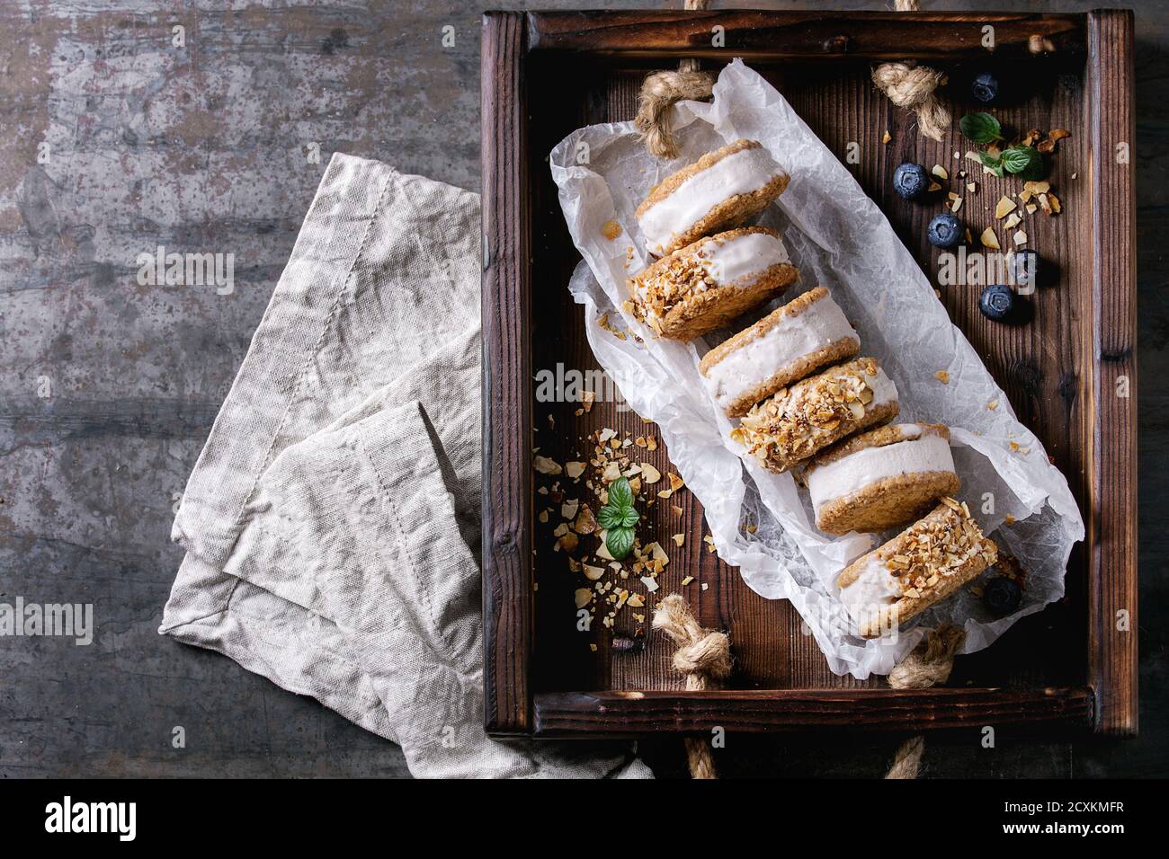 Set of homemade ice cream sandwiches in oat cookies with almond sugar ...