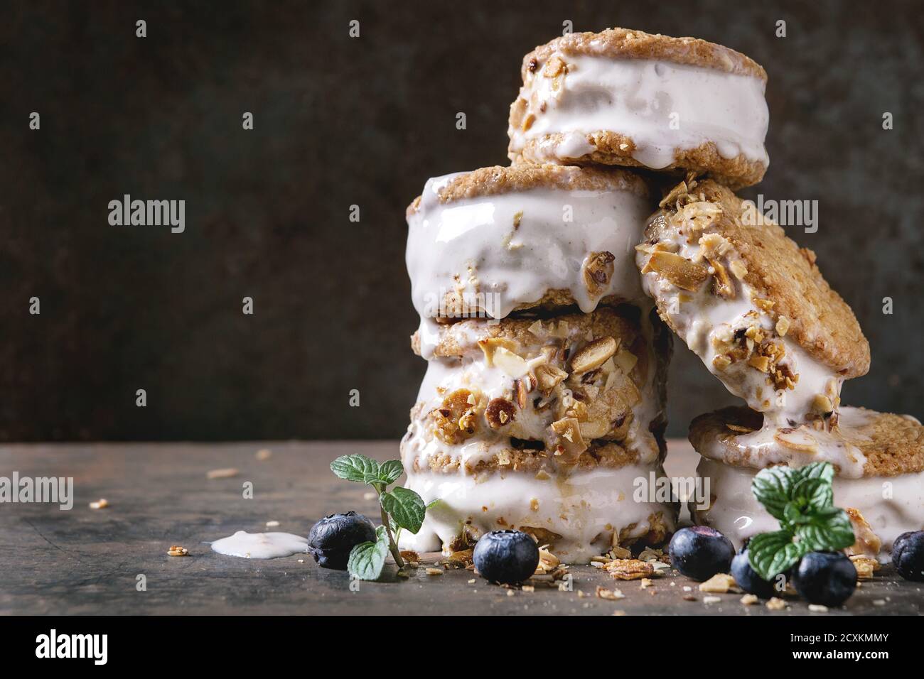 Set of homemade ice cream sandwiches in oat cookies with almond sugar ...