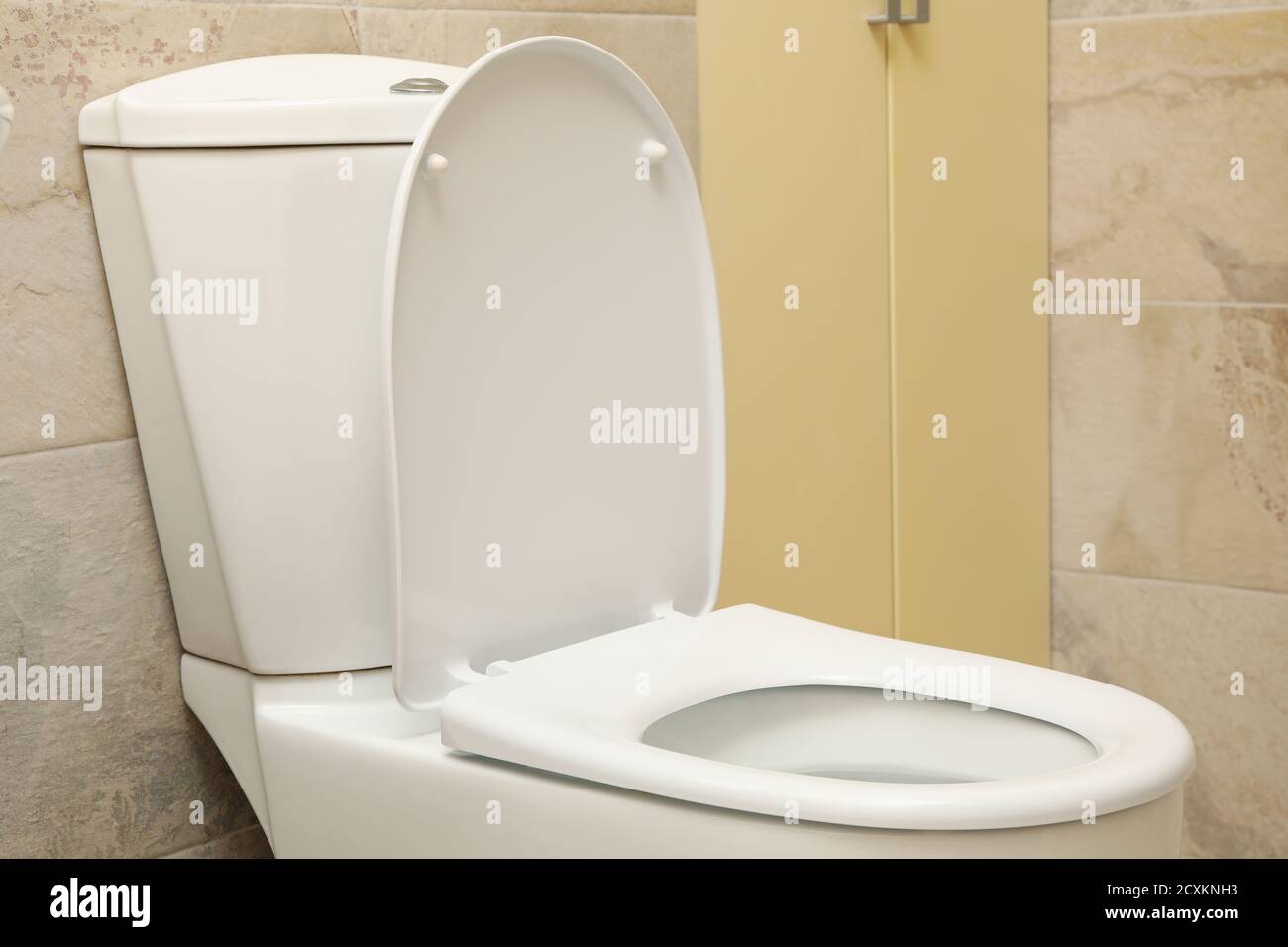 Toilet bowl in modern bathroom in light beige color Stock Photo - Alamy