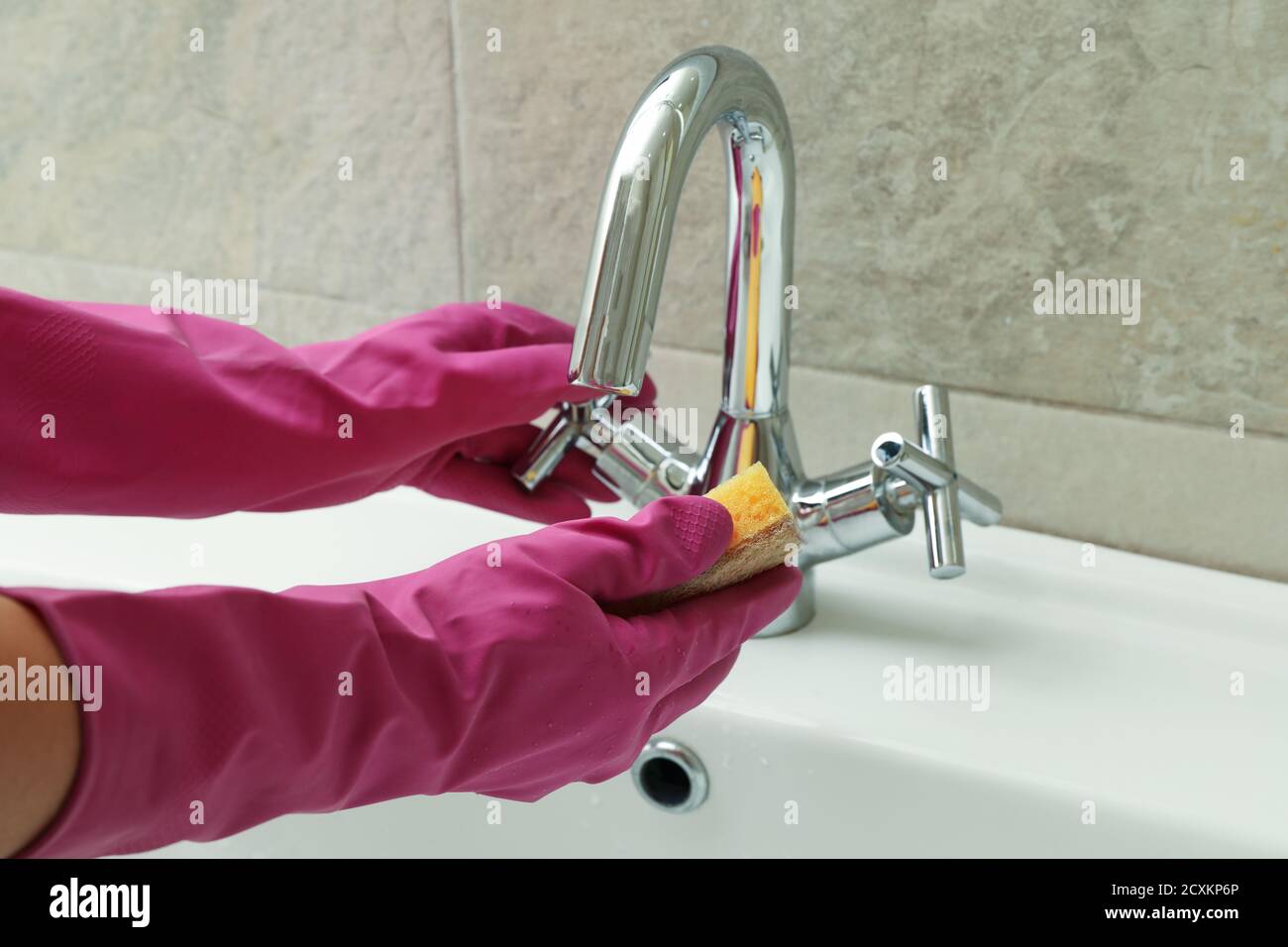 Person in bright pink cleaning hi-res stock photography and images - Alamy