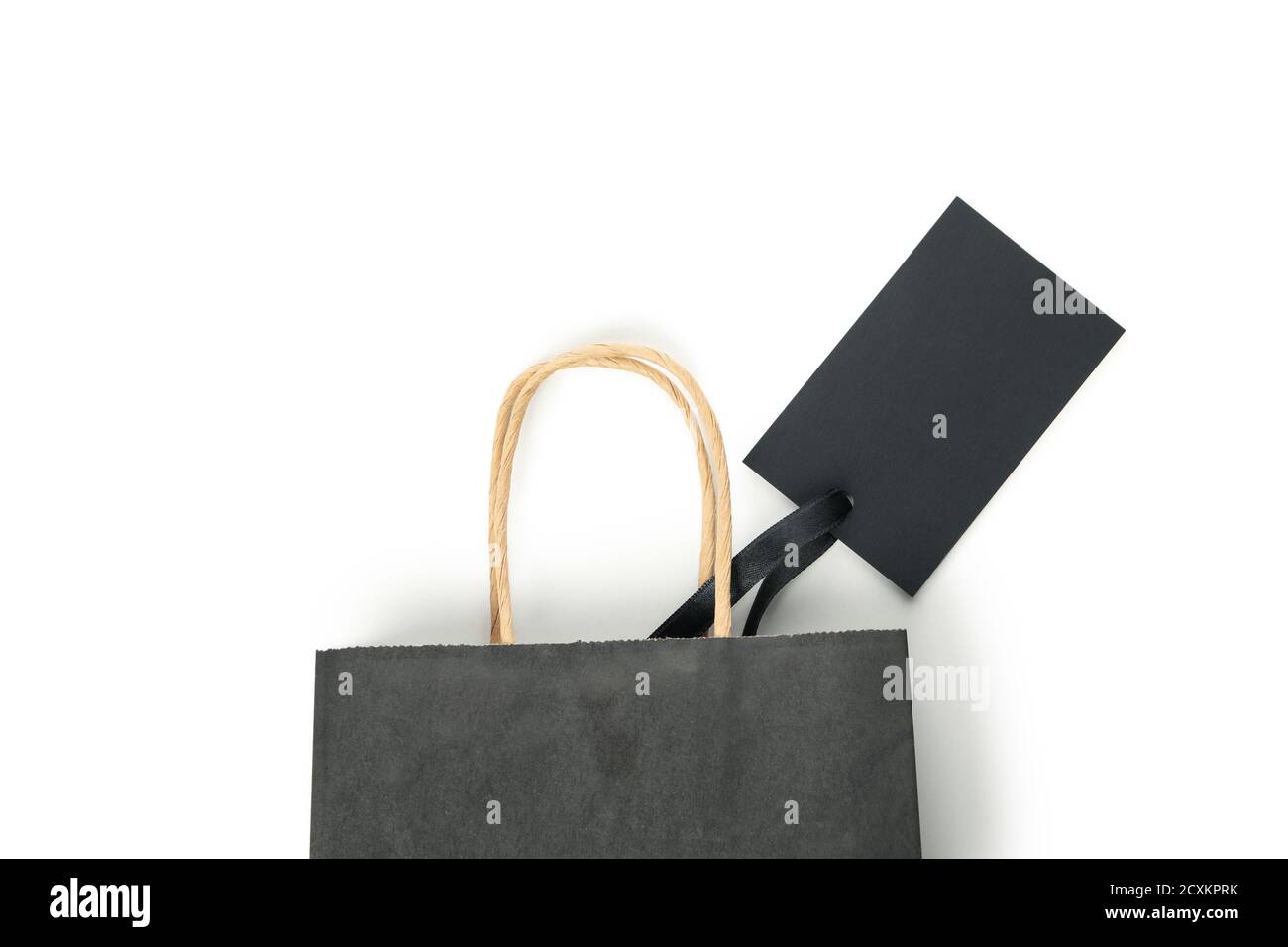 Paper bag with tag isolated on white background Stock Photo - Alamy