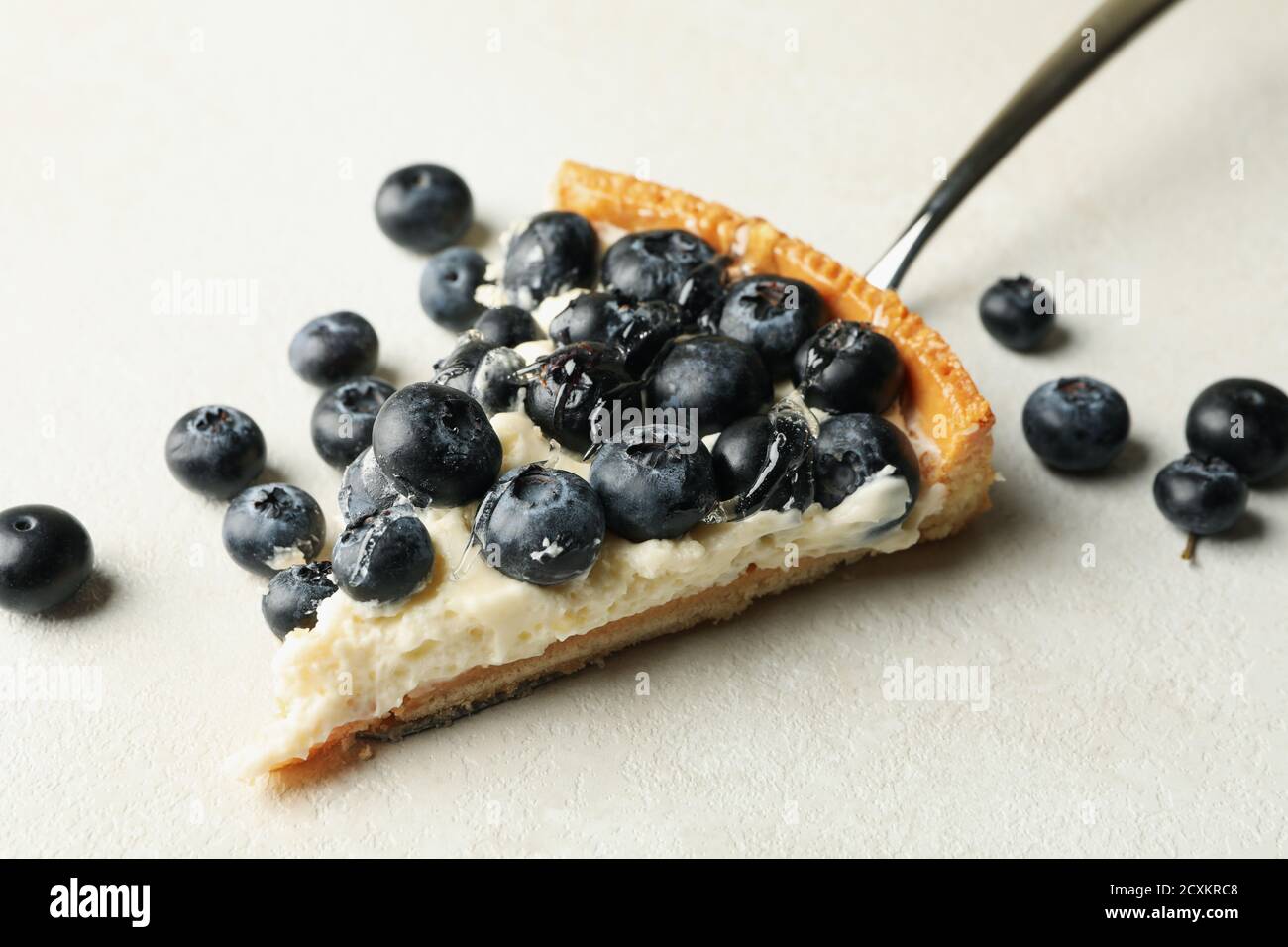 Spatula with blueberry pie slice on gray background Stock Photo - Alamy