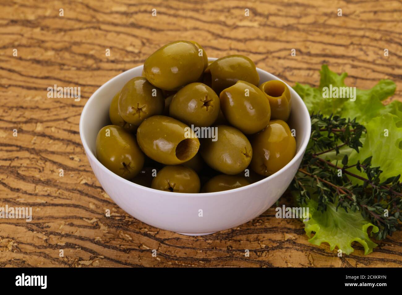 Big green olives in the bowl Stock Photo - Alamy