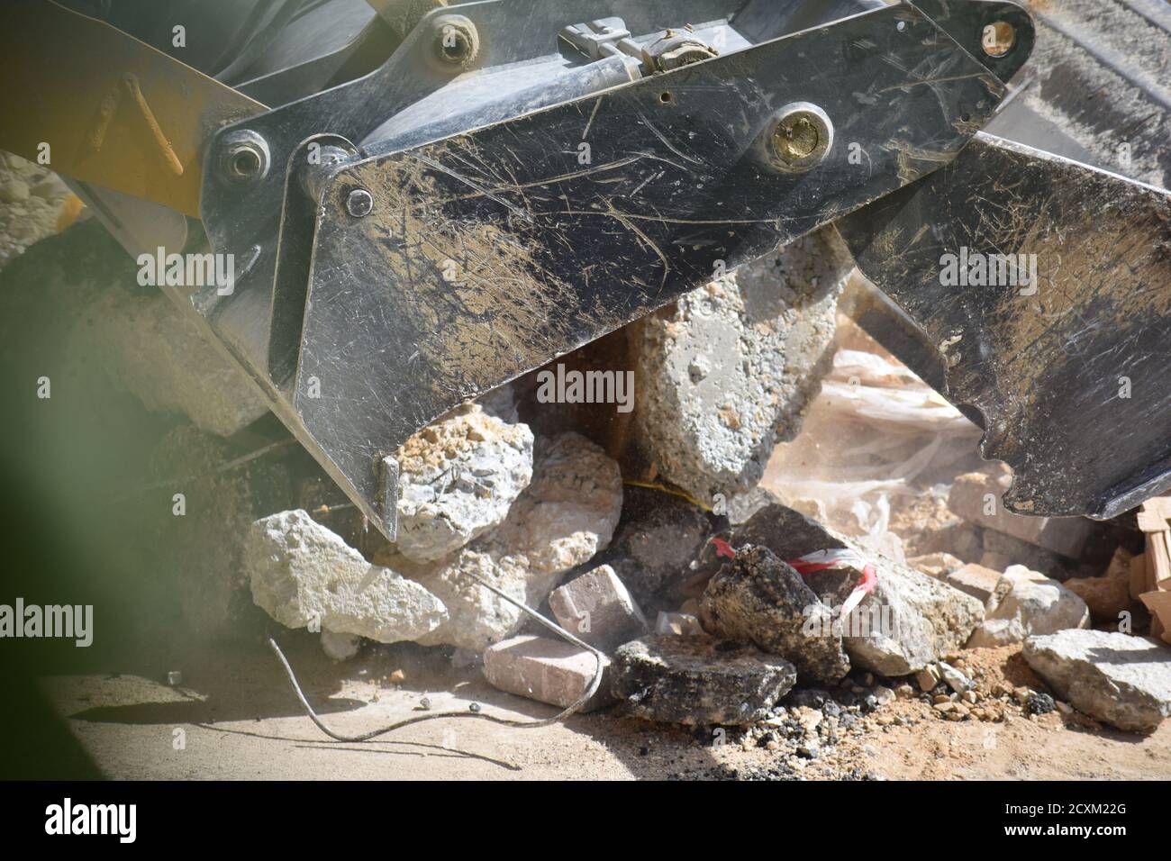 Backhoe Removing Debris Stock Photo - Alamy