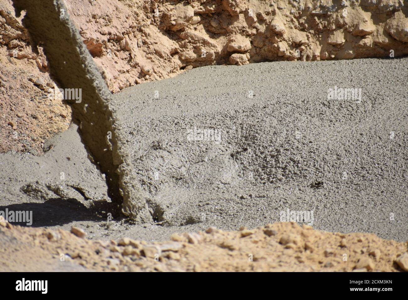 Cement being Dumped into Hole Stock Photo - Alamy
