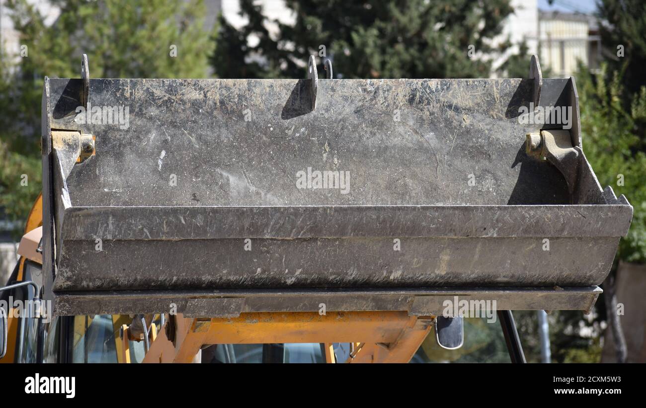 Digger with Raised Loader Bucket Stock Photo - Alamy