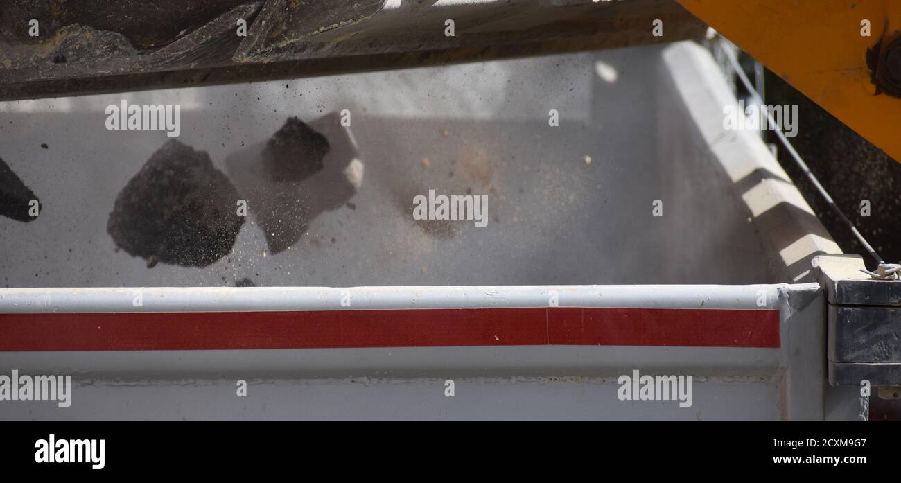 Loading construction rubble into truck hi-res stock photography and ...