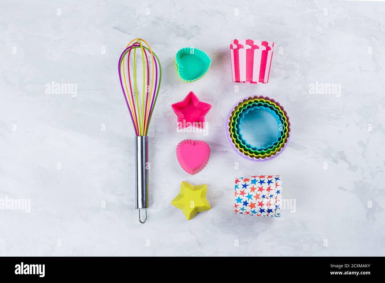 Colorful Rainbow Kitchen utensils for bakery on white marble table ...