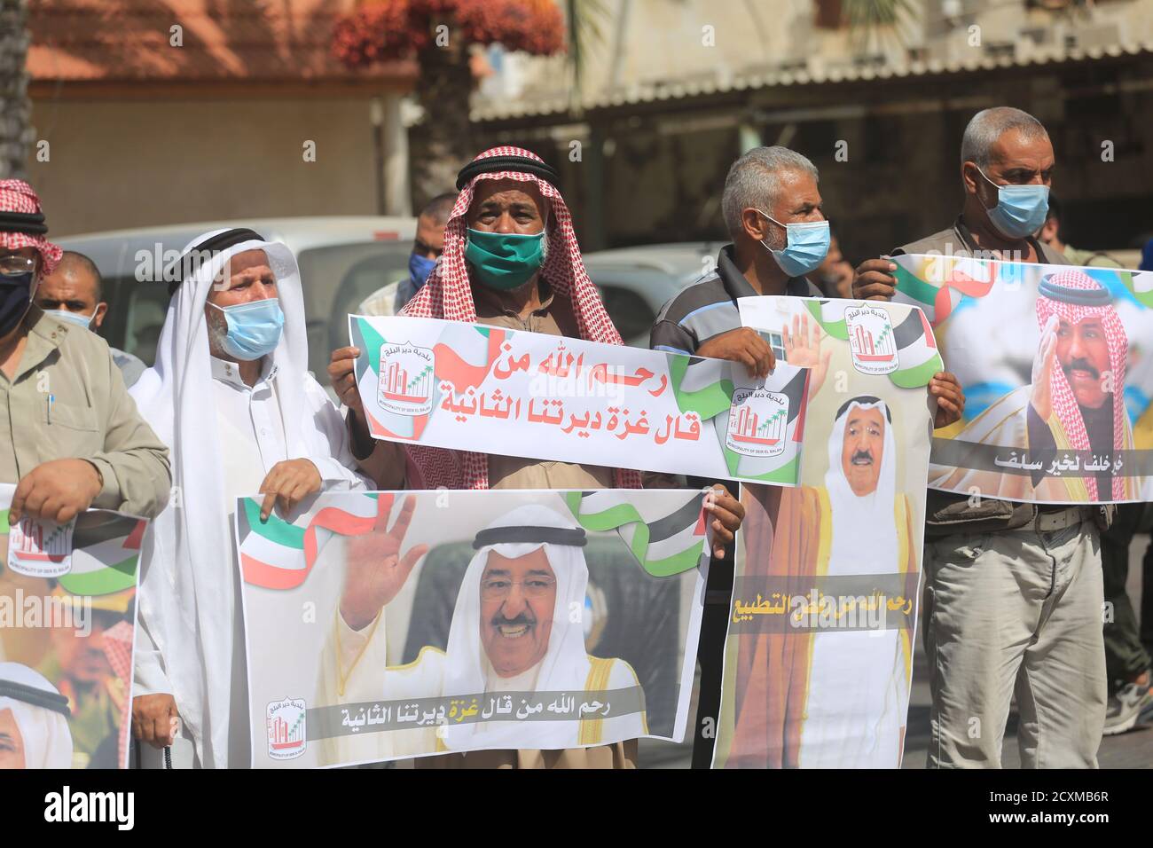 Palestinians holds banners during take part in a stand of support with ...