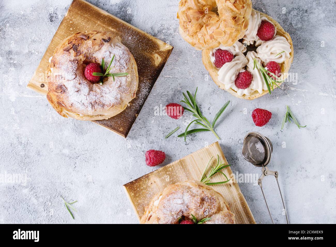 Homemade choux pastry cake Paris Brest with raspberries, almond, sugar ...