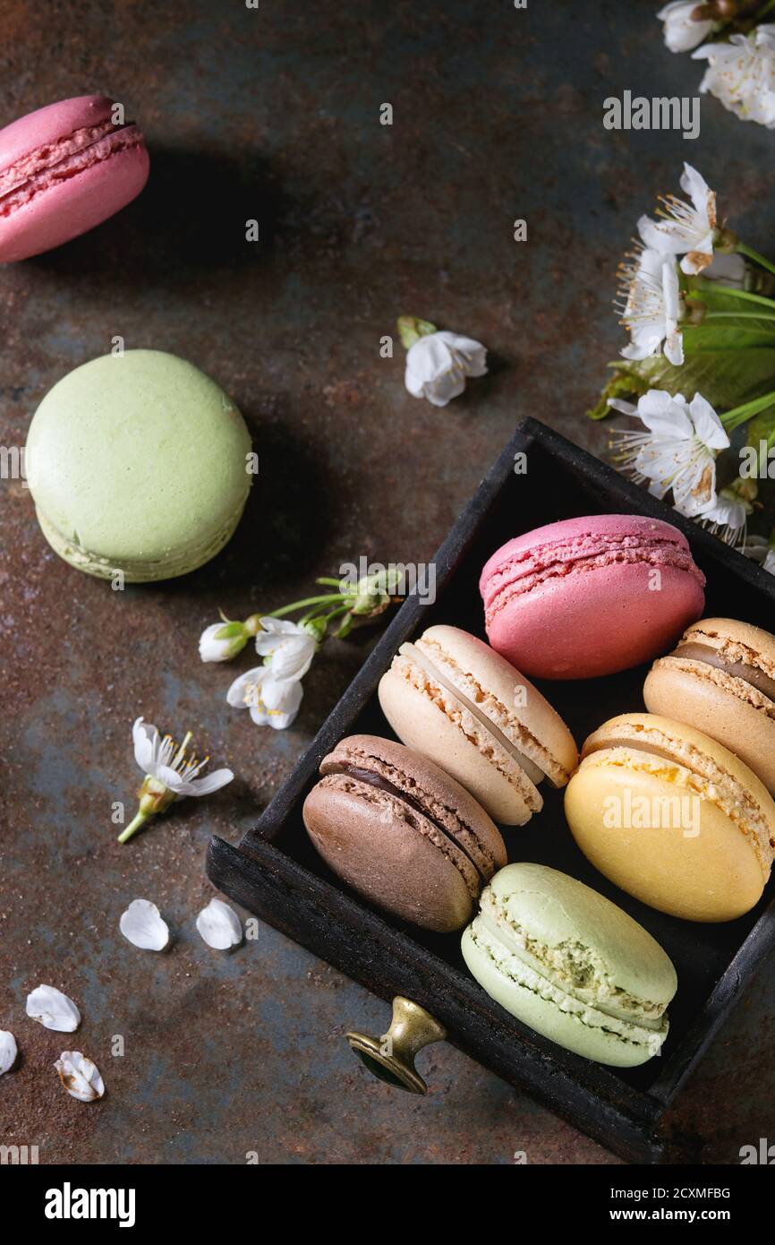 Variety of colorful french sweet dessert macaron macaroons with ...