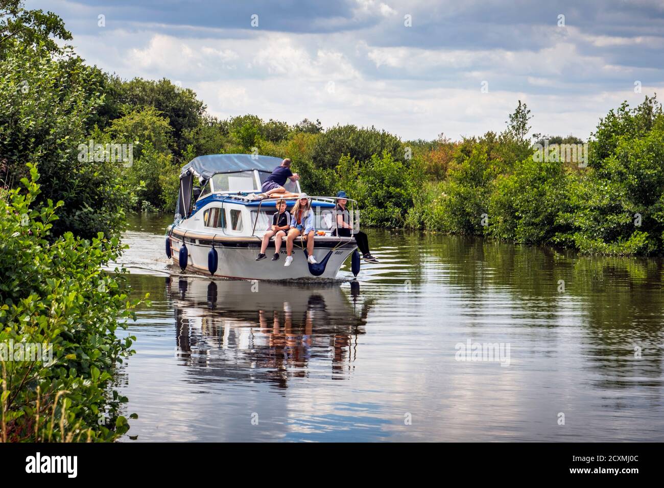 Boat sailing on the river Ant on the Norfolk Broads at How Hill, Ludham ...