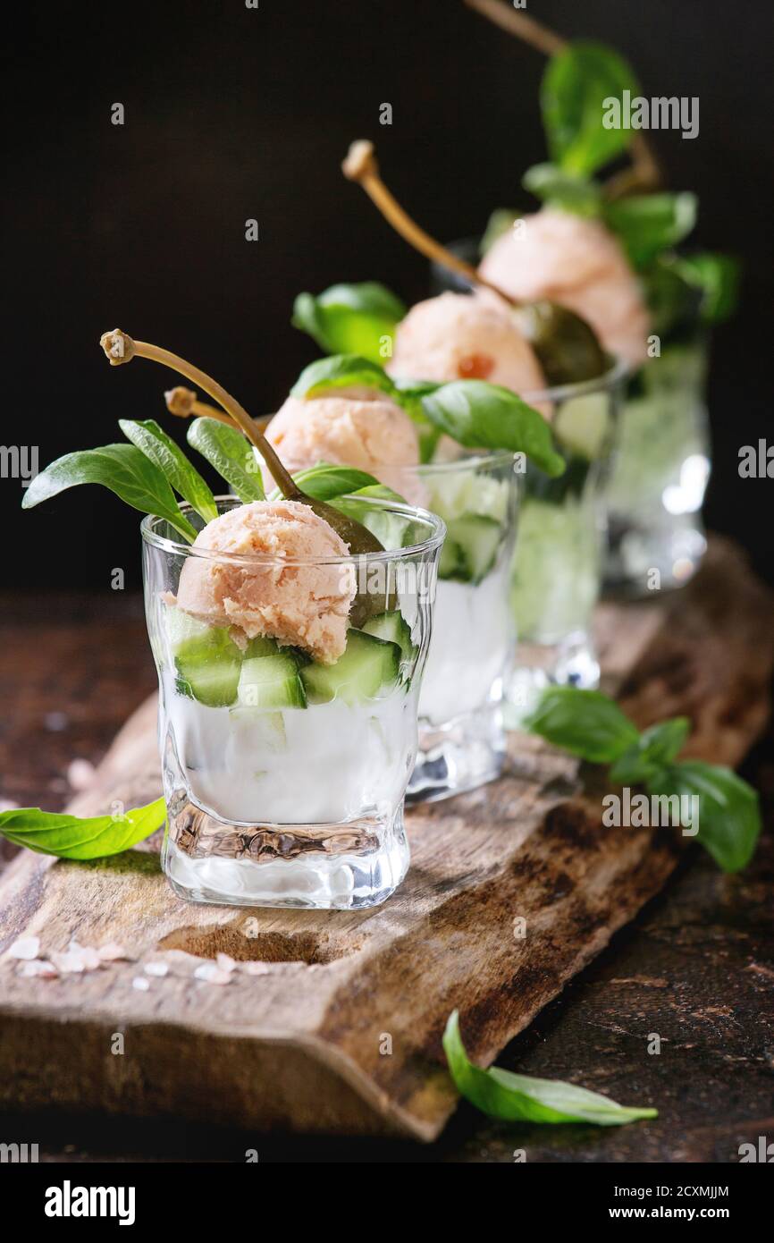 Verrines appetizer with salmon pate, red caviar, cucumber, cream cheese ...