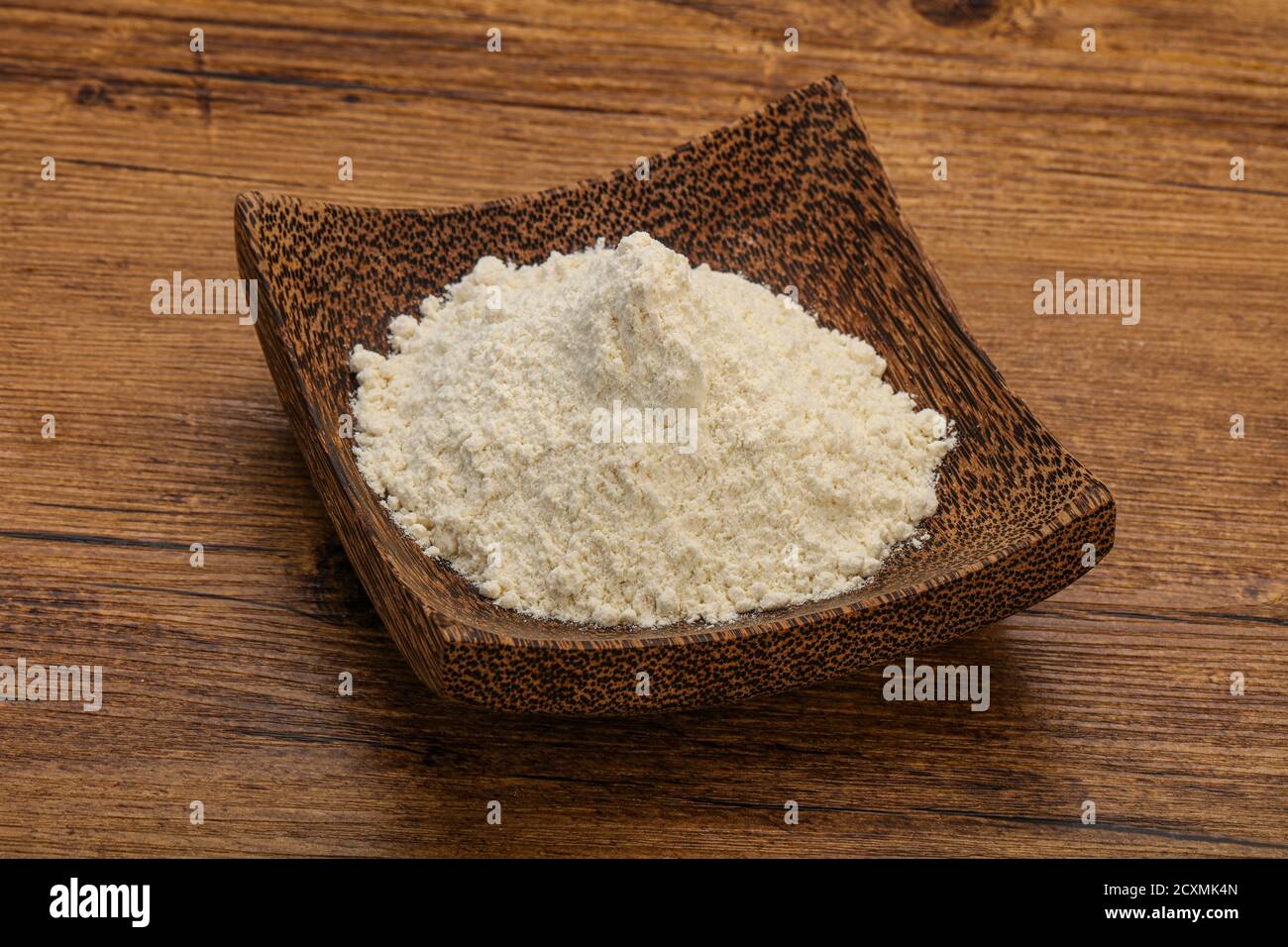 Wheat flour heap in the bowl for cooking Stock Photo - Alamy