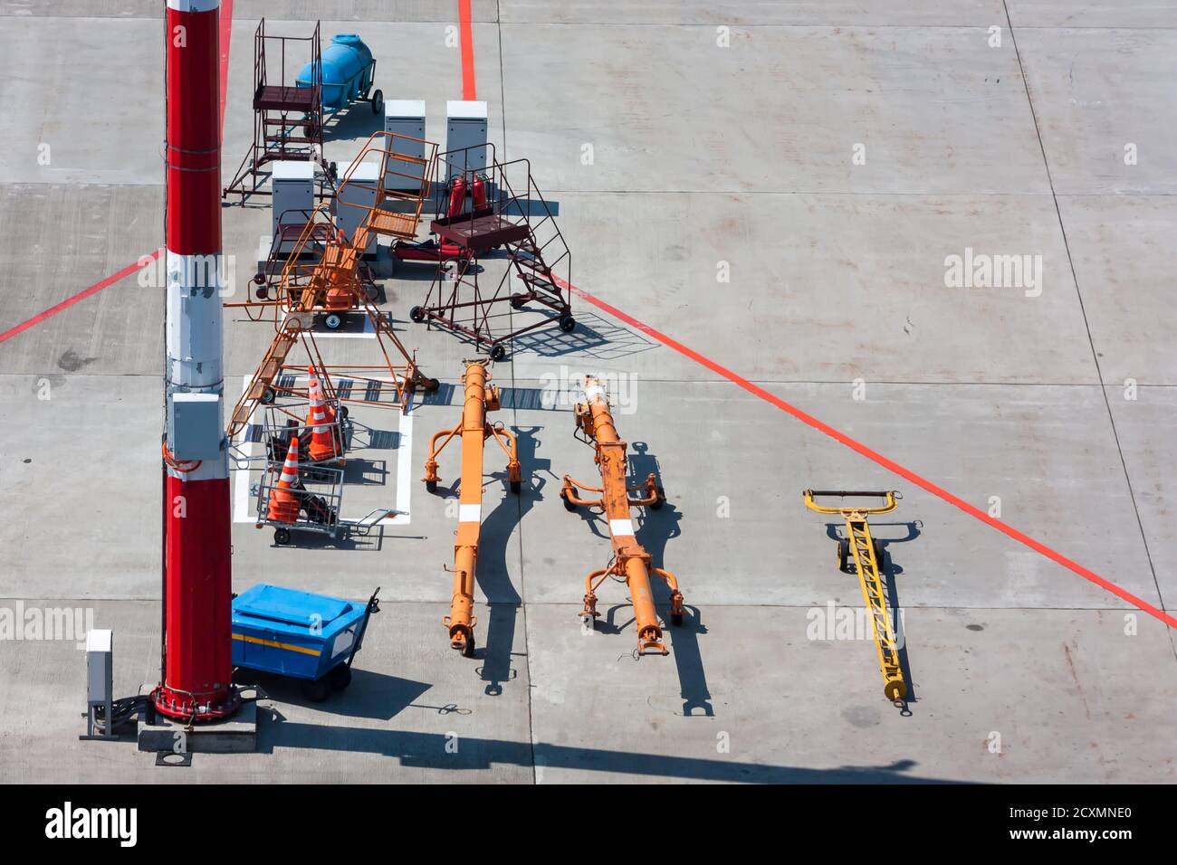 Towbars for different airplanes, aircraft steps and signal cones at the ...