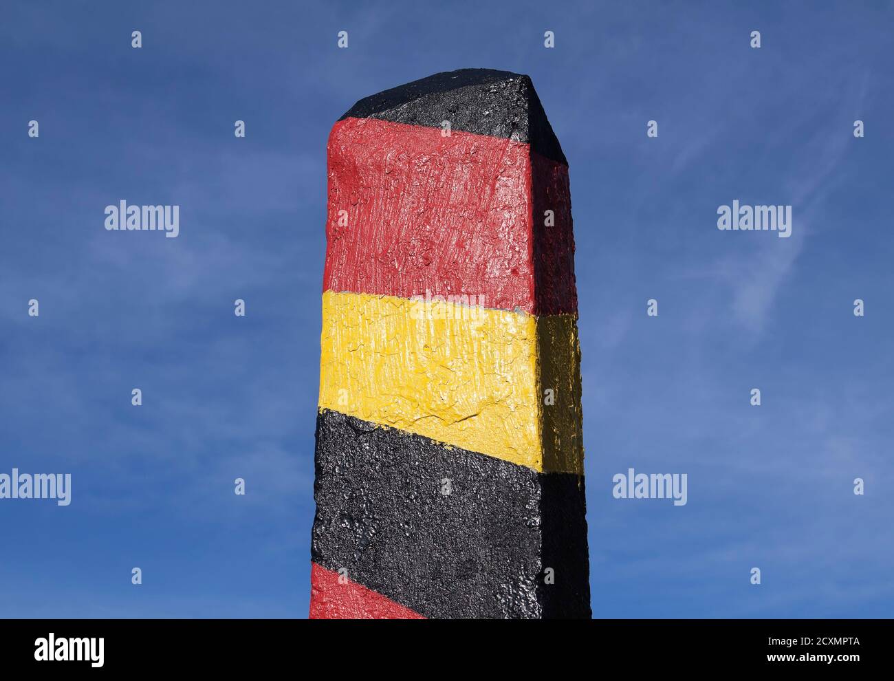 Boundary post in national colours of Germany Stock Photo - Alamy
