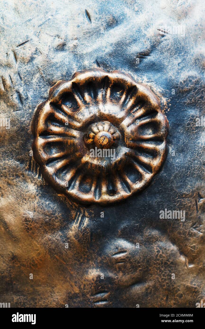Antique metal shield with a textured surface. Close up Stock Photo - Alamy