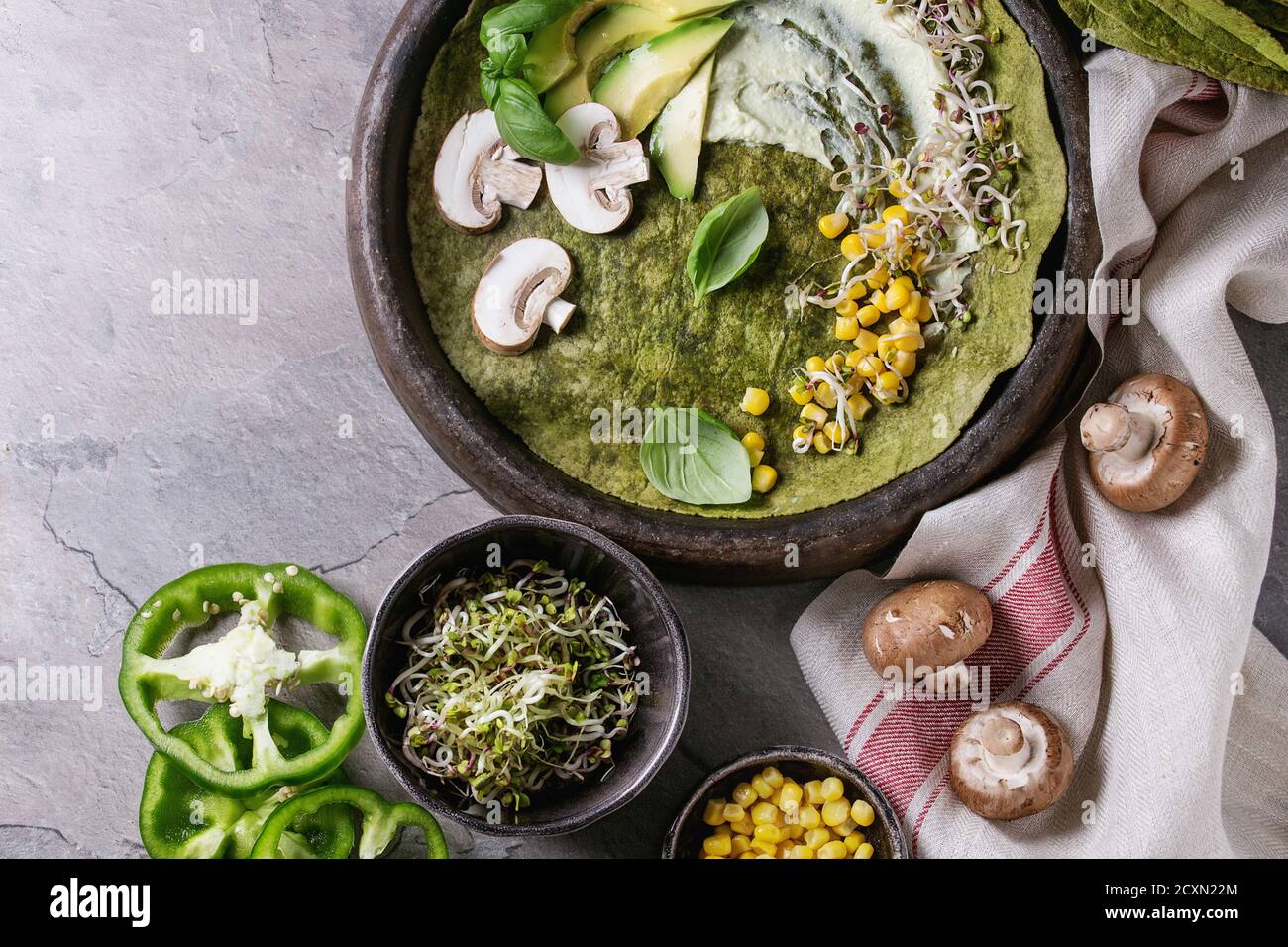 Green spinach matcha tortilla with vegan ingredients for filling. Sweet ...