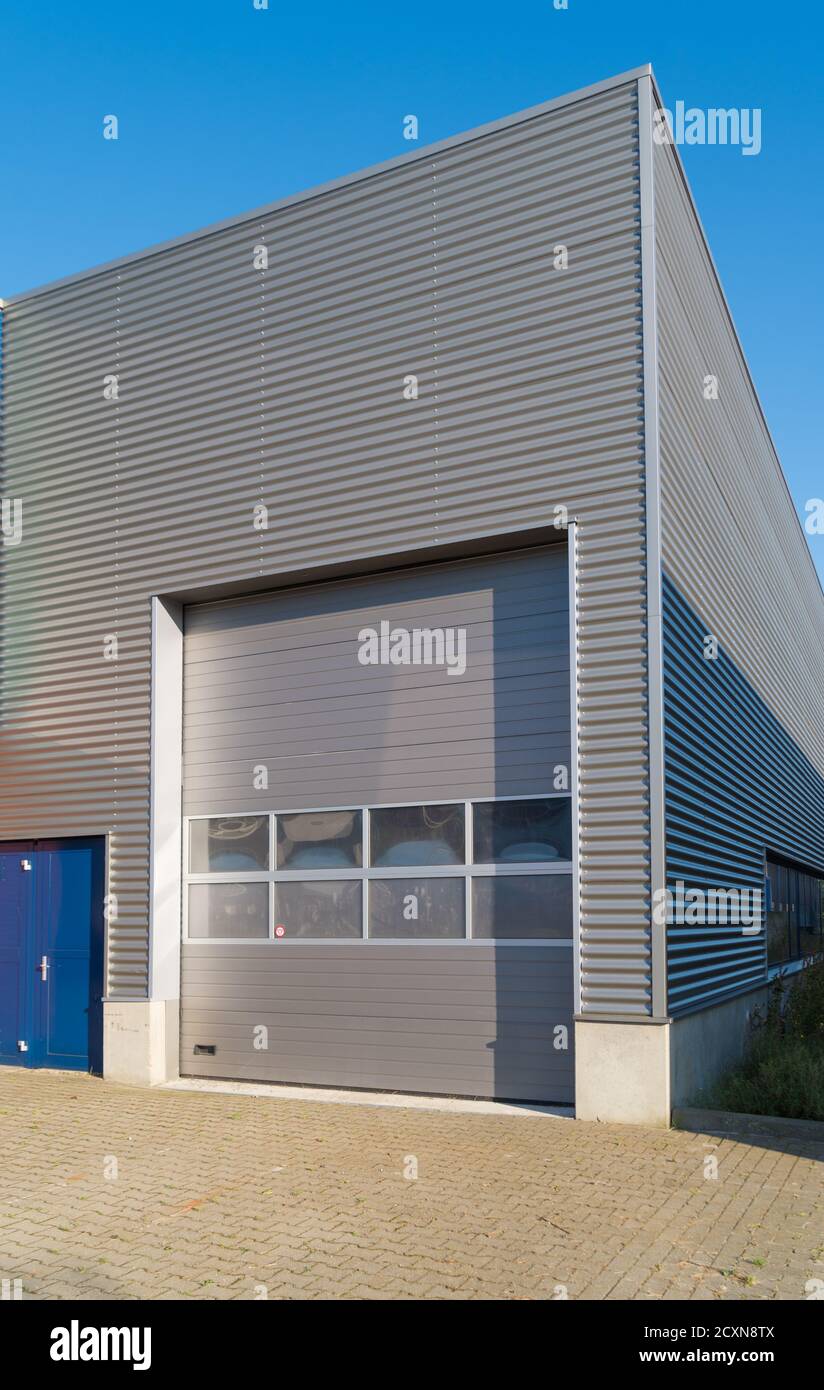 modern industrial unit with roller doors Stock Photo - Alamy