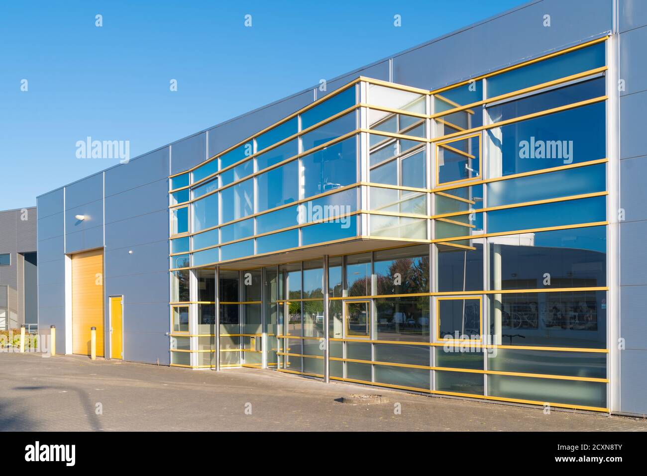modern industrial unit with roller doors Stock Photo - Alamy
