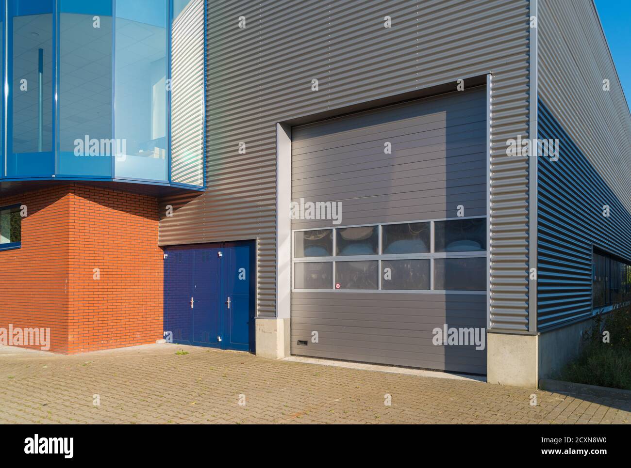 modern industrial unit with roller doors Stock Photo - Alamy