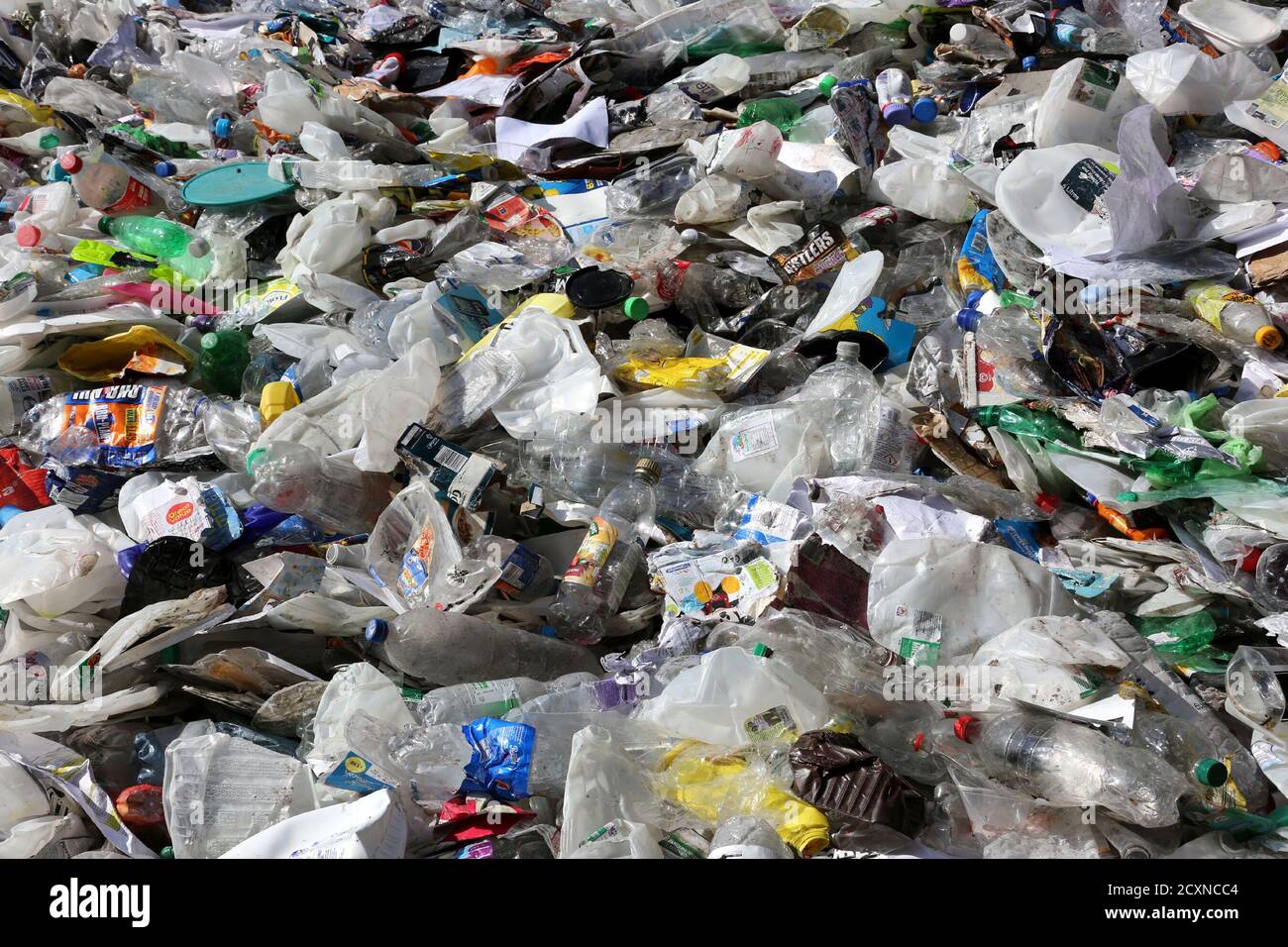 Different piles & stacks of various material being recycled ...