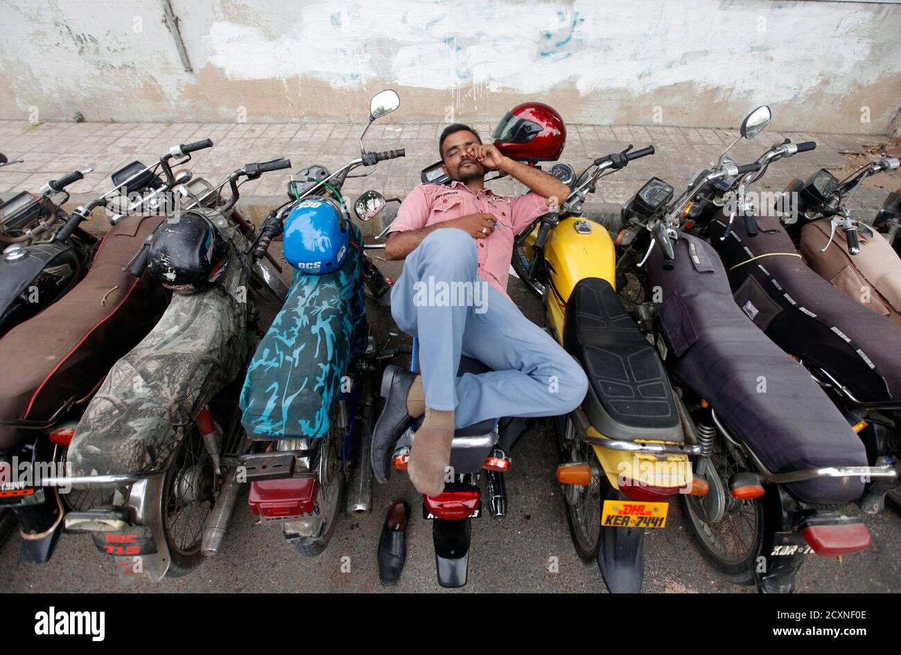 Man sleep motorcycle hi-res stock photography and images - Alamy