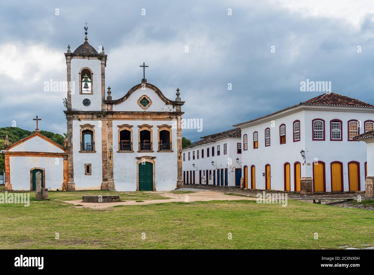 Exterior facade of old catholic church and houses in brazilian ...