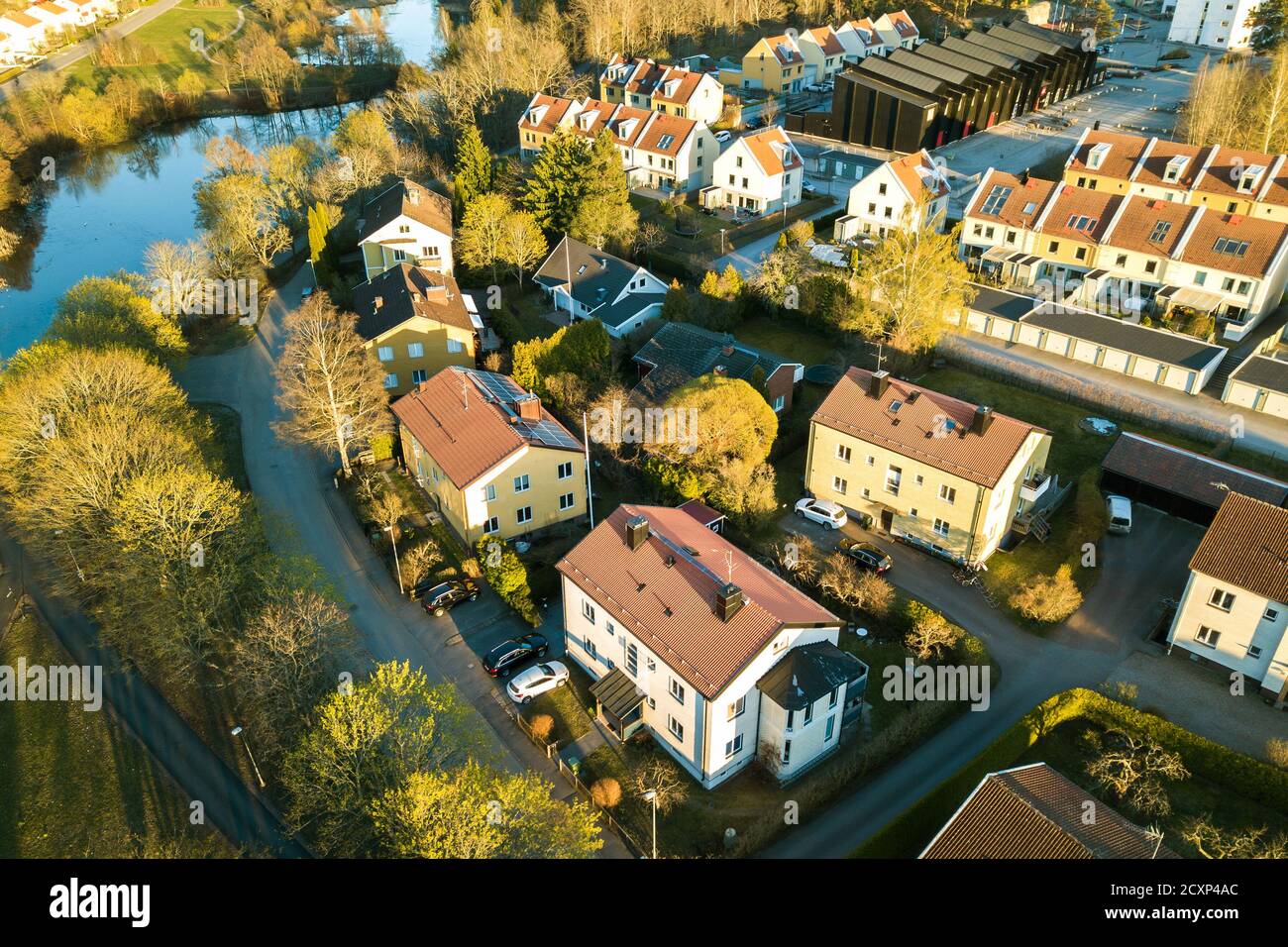 Aerial view of residential houses with red roofs and streets with ...