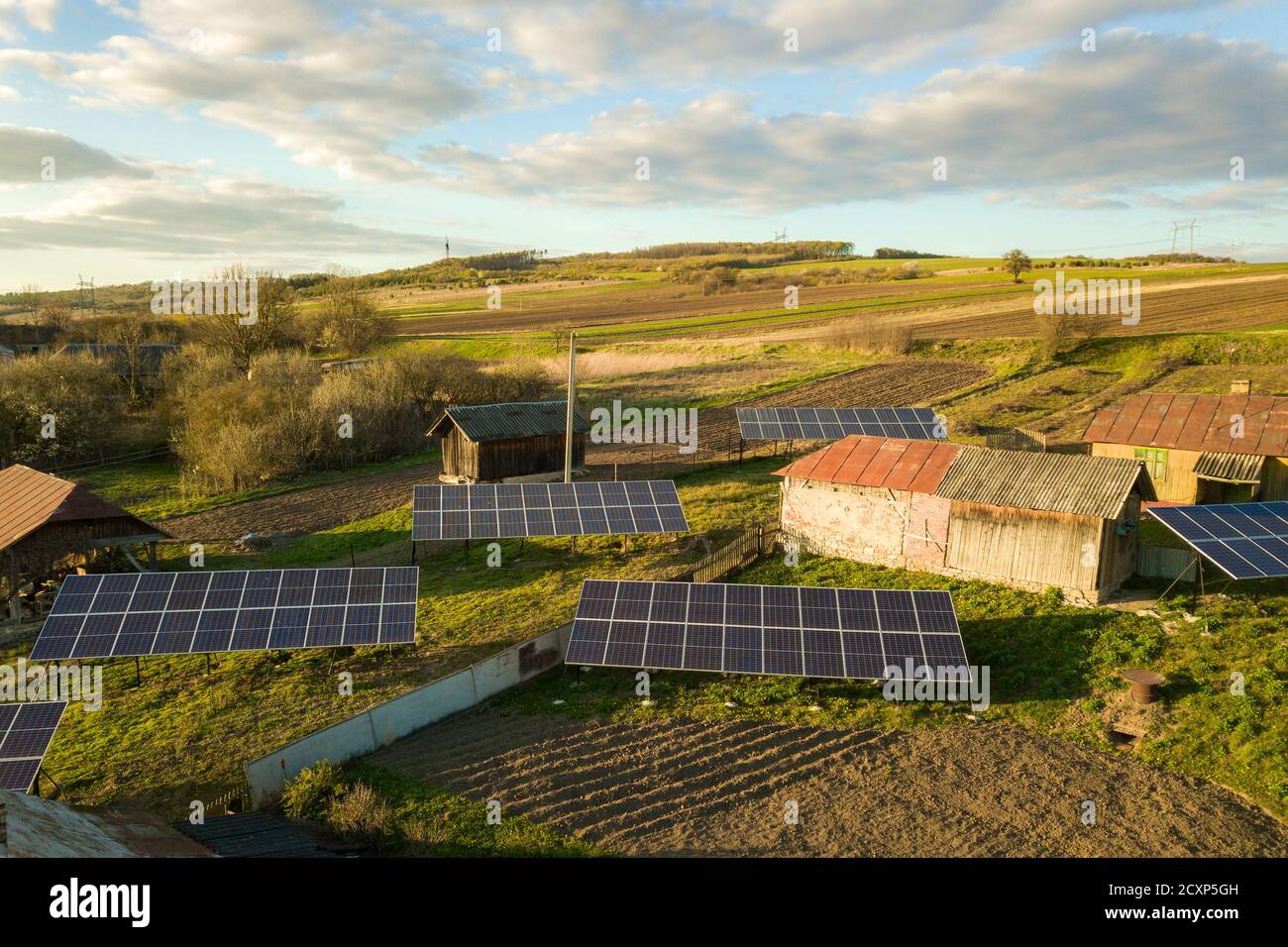 Aerial top down view of solar panels in green rural village yard Stock ...