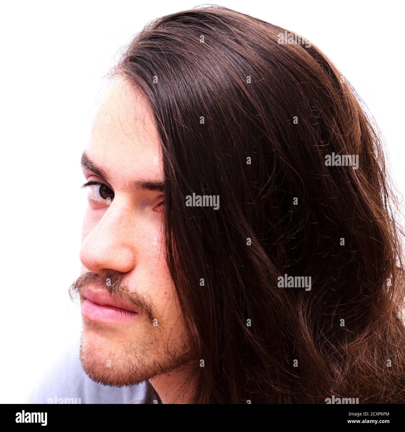 Young man with long dark shiny hair Stock Photo - Alamy
