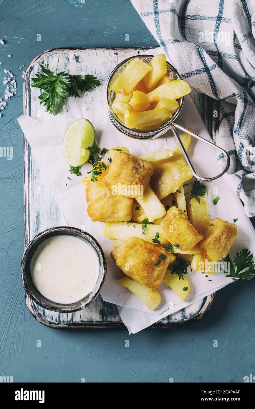 Traditional british fast food fish and chips. Served with white cheese ...