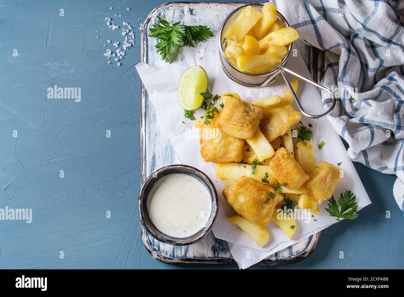 Traditional british fast food fish and chips. Served with white cheese ...