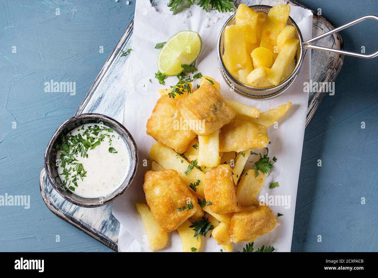 Traditional british fast food fish and chips. Served with white cheese ...