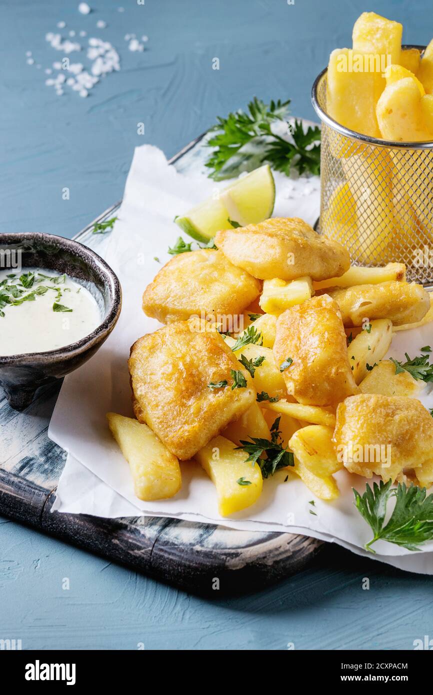 Traditional british fast food fish and chips. Served with white cheese ...