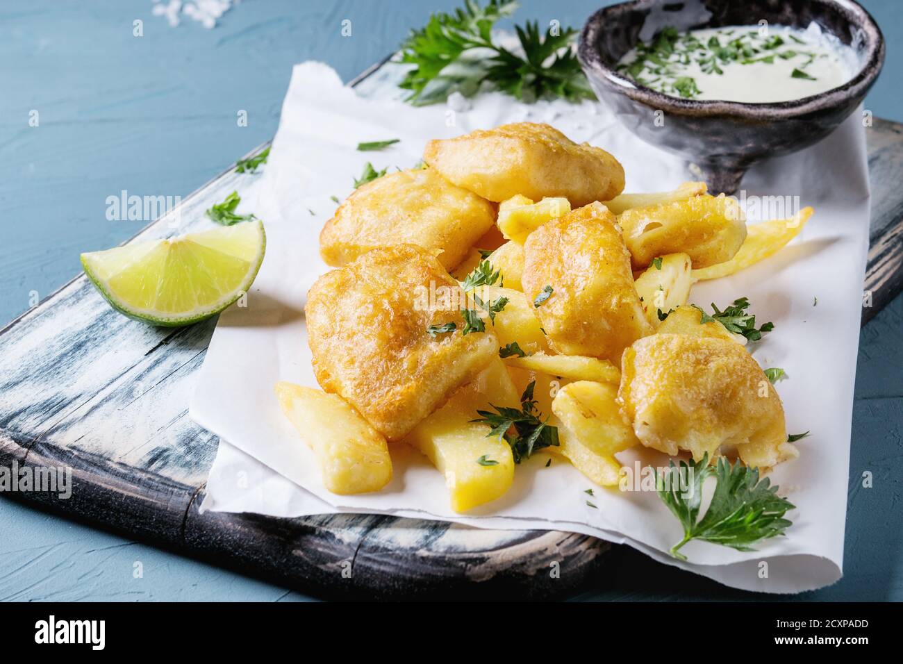 Traditional british fast food fish and chips. Served with white cheese ...