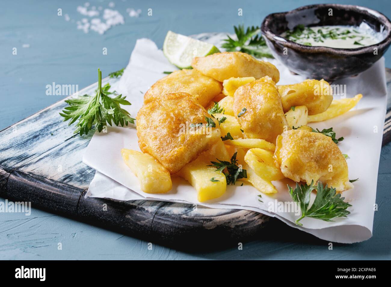 Traditional british fast food fish and chips. Served with white cheese ...