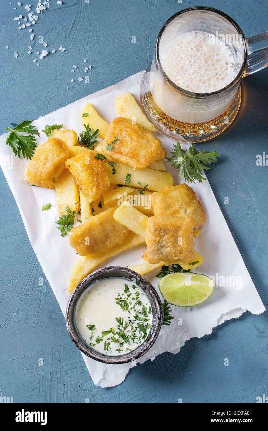 Traditional british fast food fish and chips. Served with white cheese ...