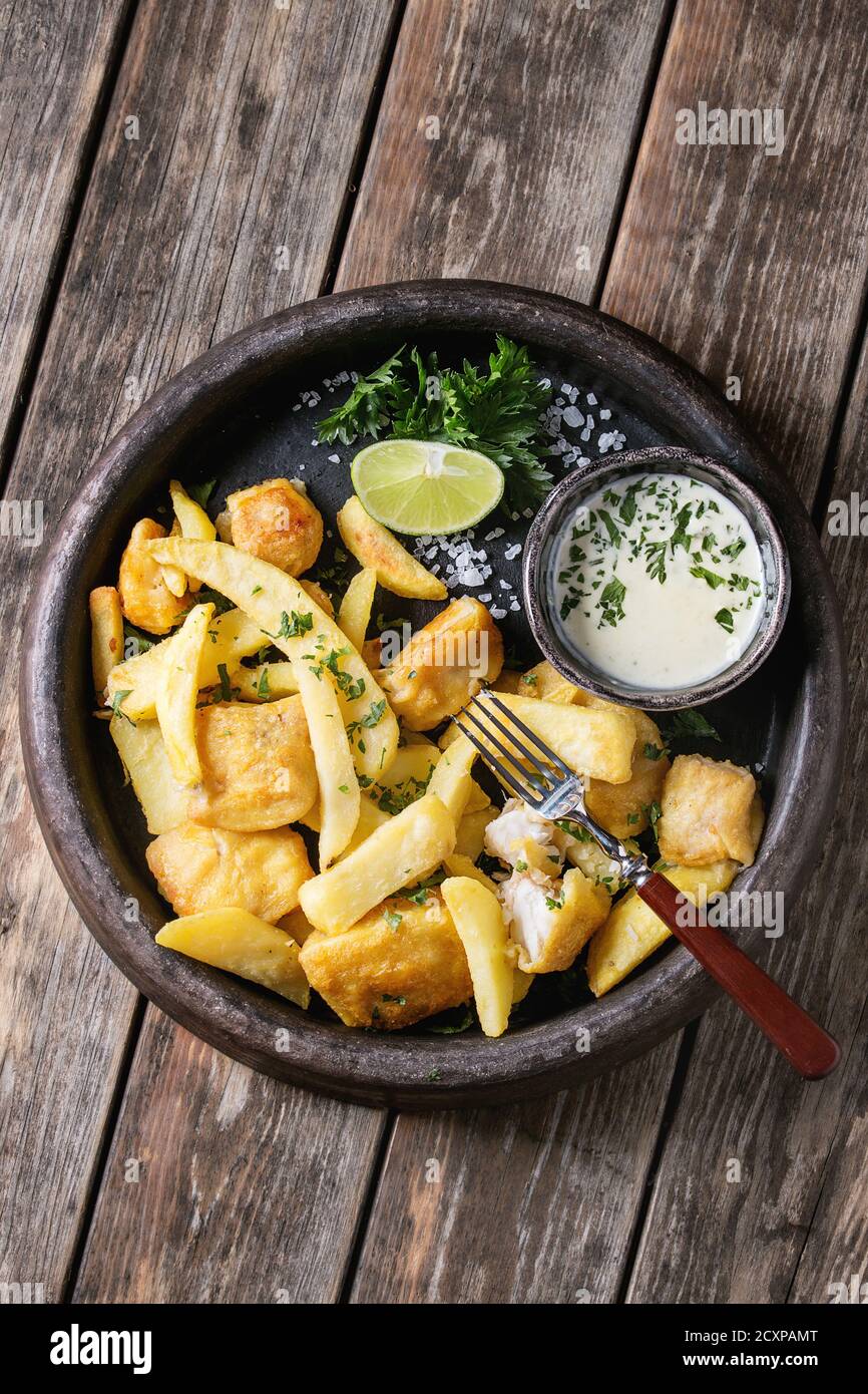 Traditional british fast food fish and chips. Served with white cheese ...