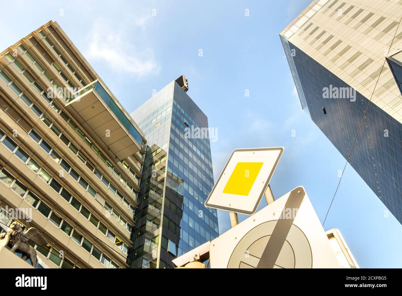 Perspective view of modern high-rise glass skyscraper building and main ...