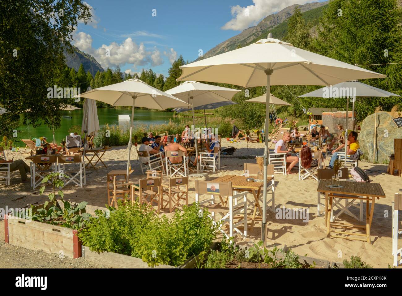 Tasch, Switzerland - 18 July 2020: people drinking in a beach bar of ...