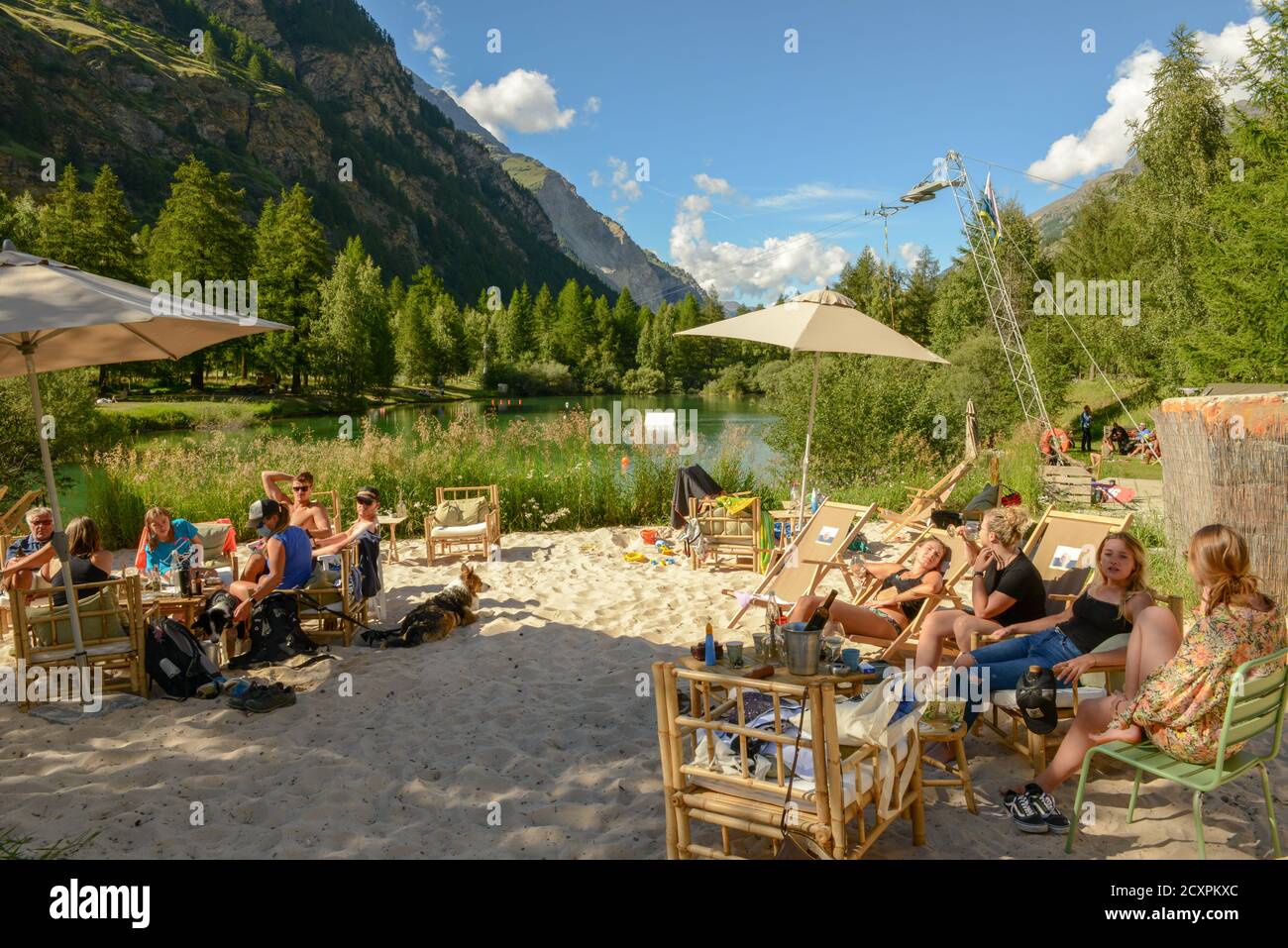 Tasch, Switzerland - 18 July 2020: people drinking in a beach bar of ...